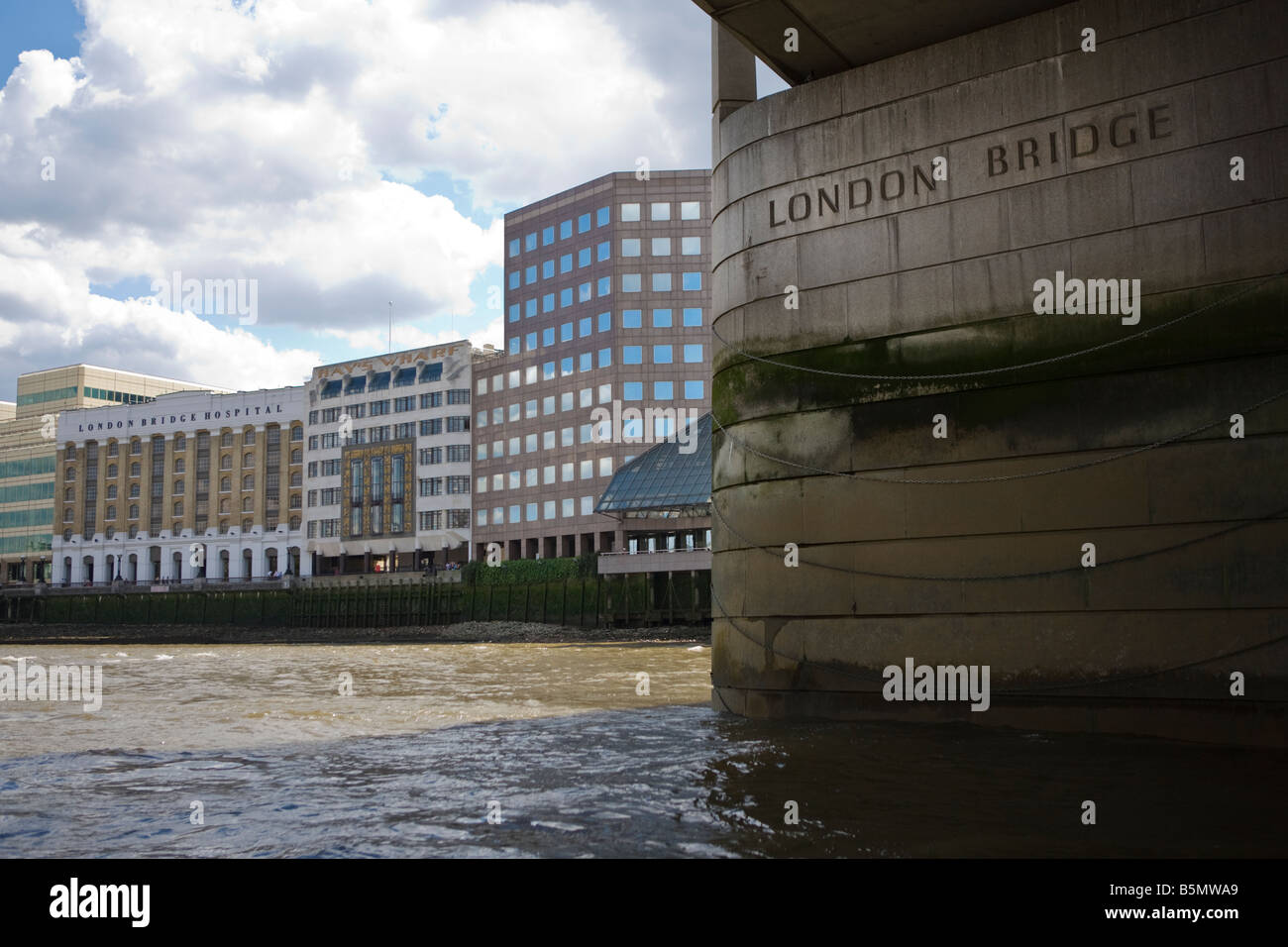 A view across The River Thames from underneath London Bridge Stock ...