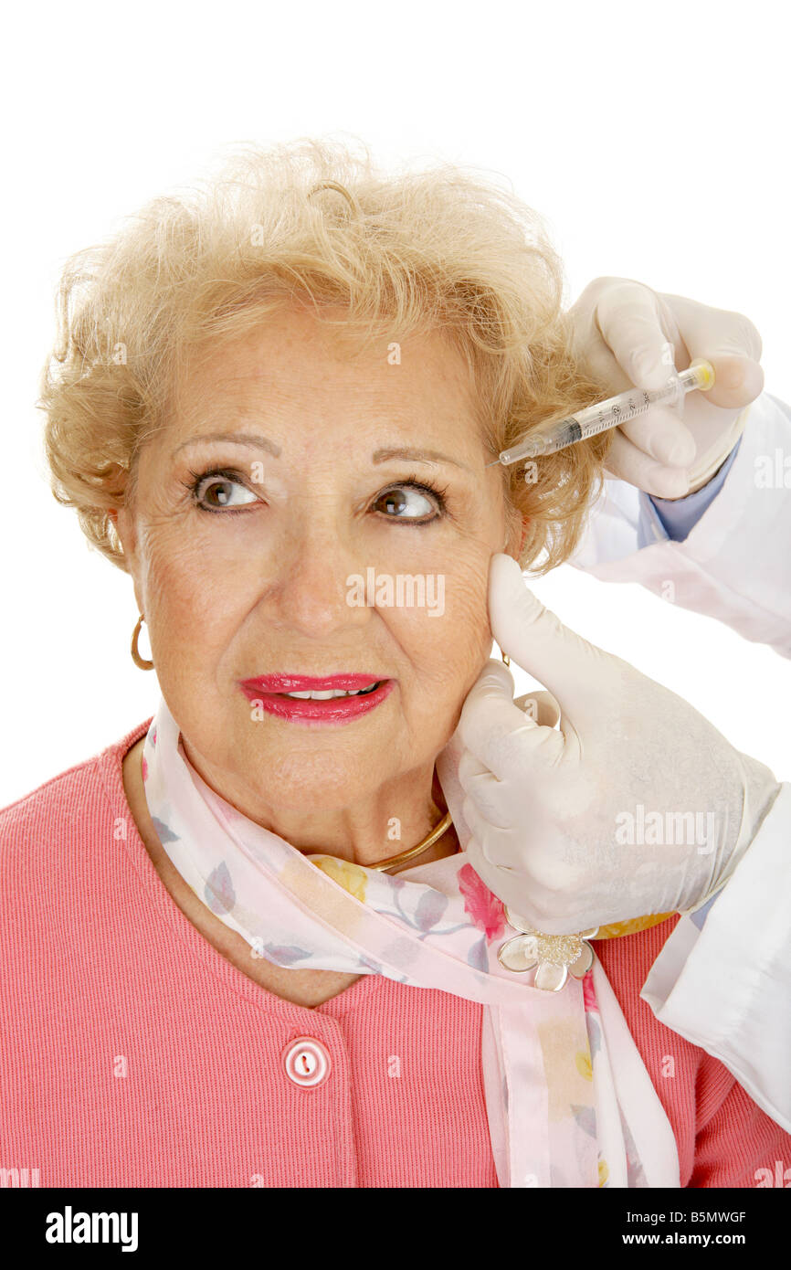 Mature woman receiving injections hi-res stock photography and images ...