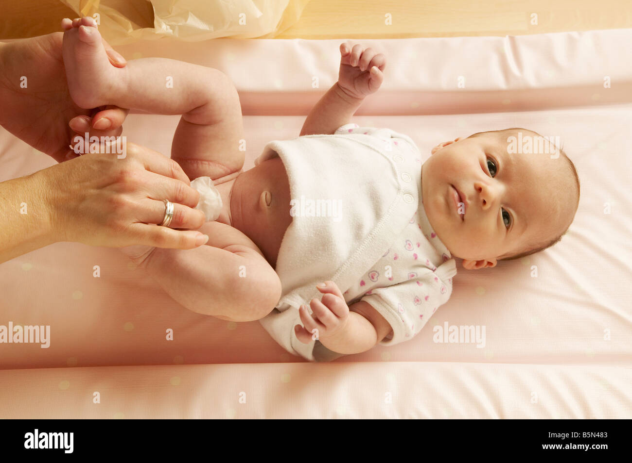 Changing babys diaper hi-res stock photography and images - Alamy