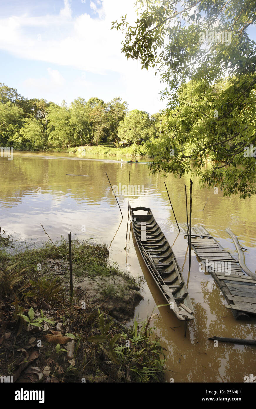 Longboat moored on a Sarawak river Stock Photo - Alamy