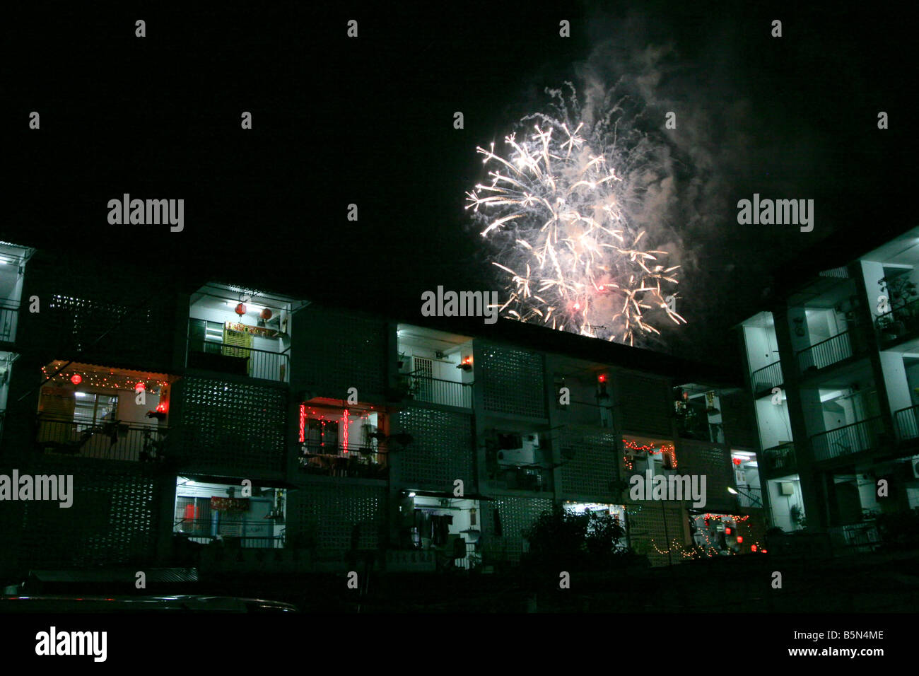 chinese new year fireworks over buildings in georgetown, penang island ...