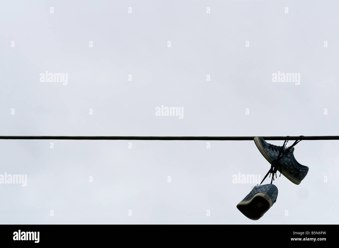 Shoes on wire hi-res stock photography and images - Alamy