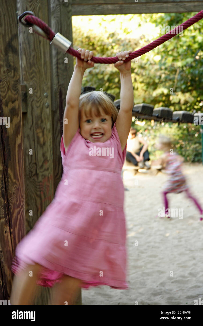 Portrait little girl climbing frame hi-res stock photography and images ...