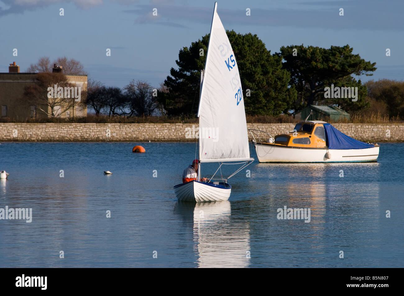 Man sailing small dingy towards camera Stock Photo - Alamy