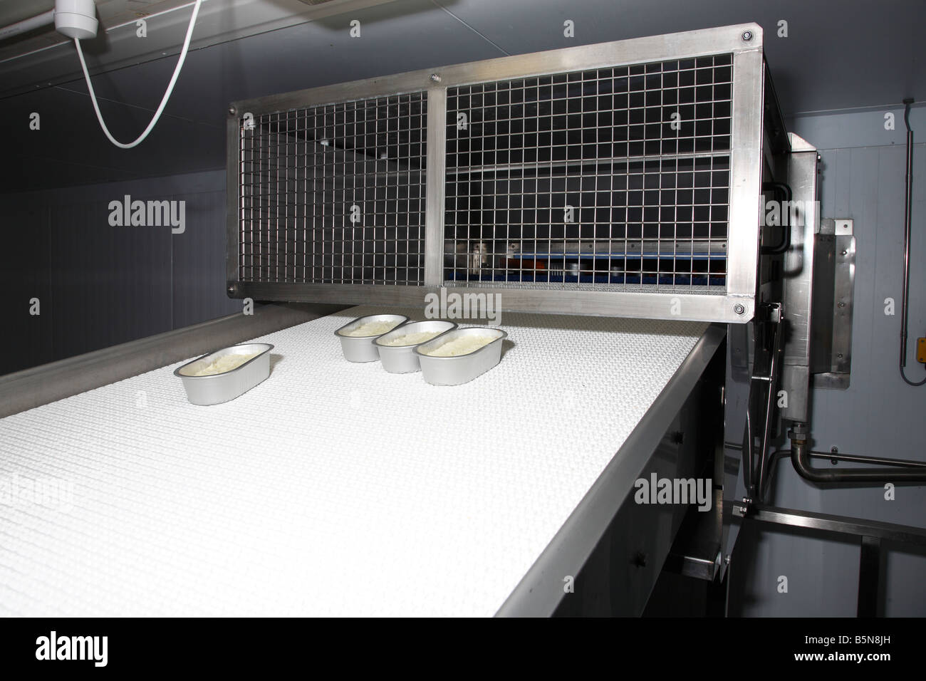 Ready meals on a frozen food production line Stock Photo - Alamy