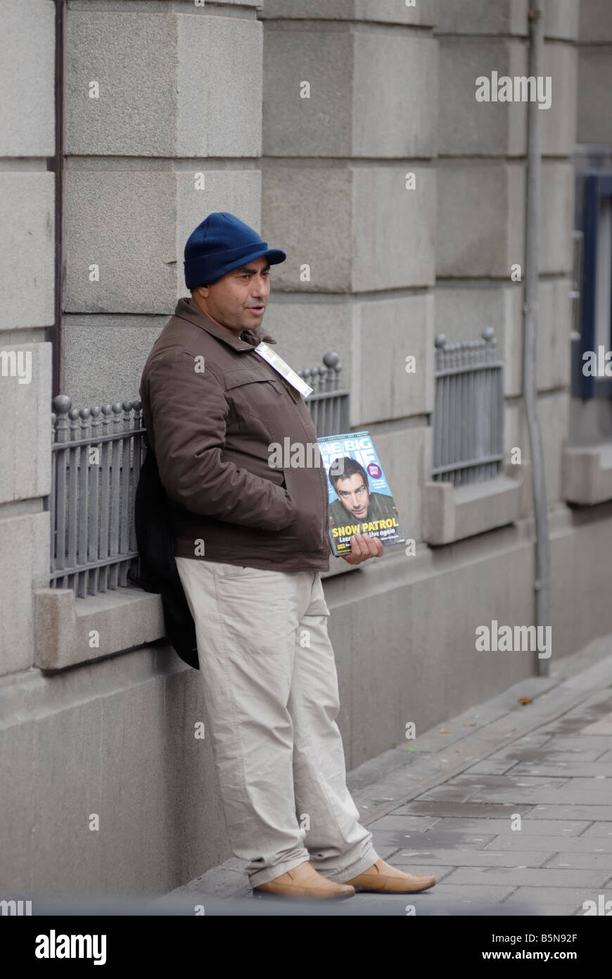 Big Issue homeless magazine vendor Stock Photo - Alamy