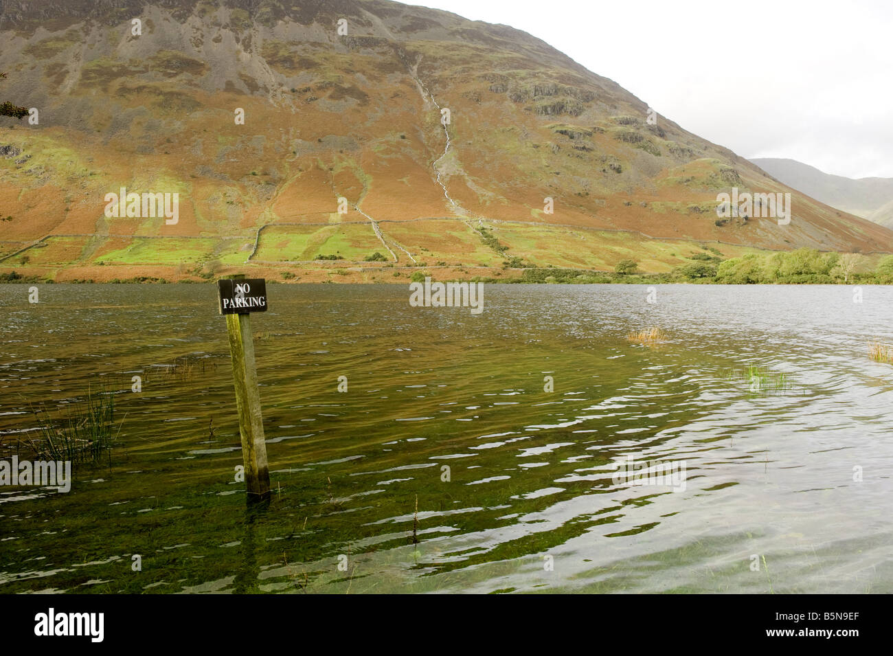 No Parking sign in flooded lake Wastwater English Lake District Stock ...