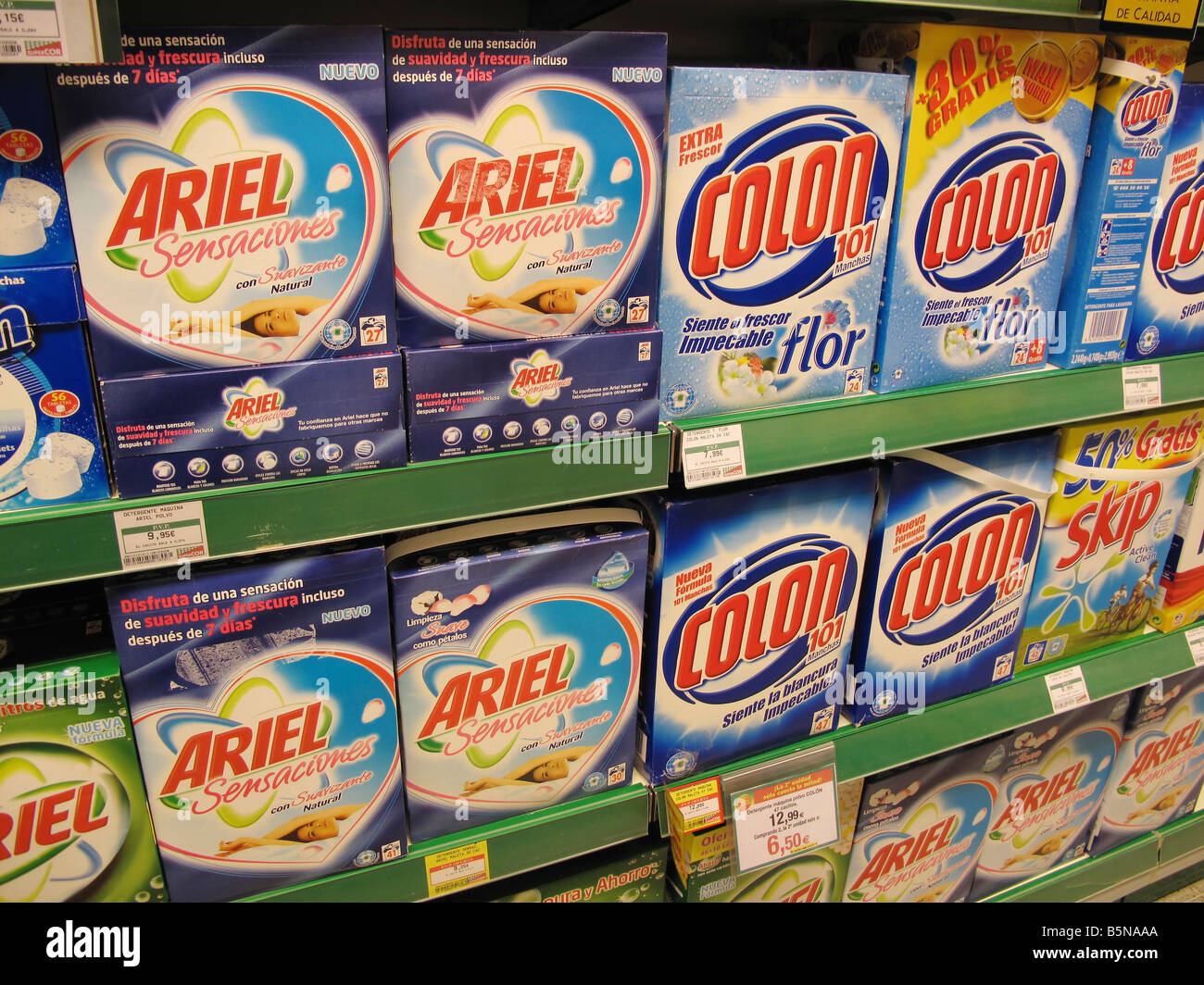 Three different brands of washing machine powder on supermarket shelf ...