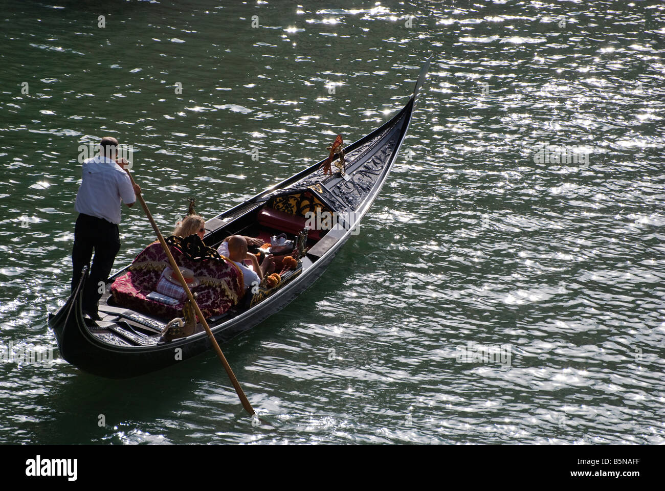 Venice gondolier rowing his gondola on Grand Canal Venice Italy Stock ...