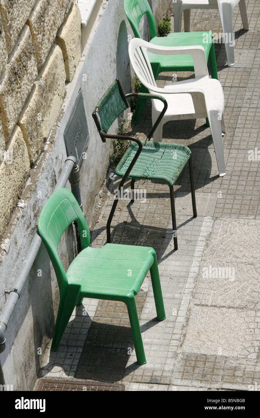row of old chairs outside in street road Stock Photo - Alamy