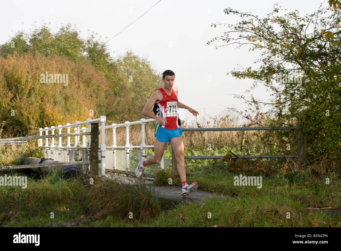 Male runner leading field to win race and break course record in the ...