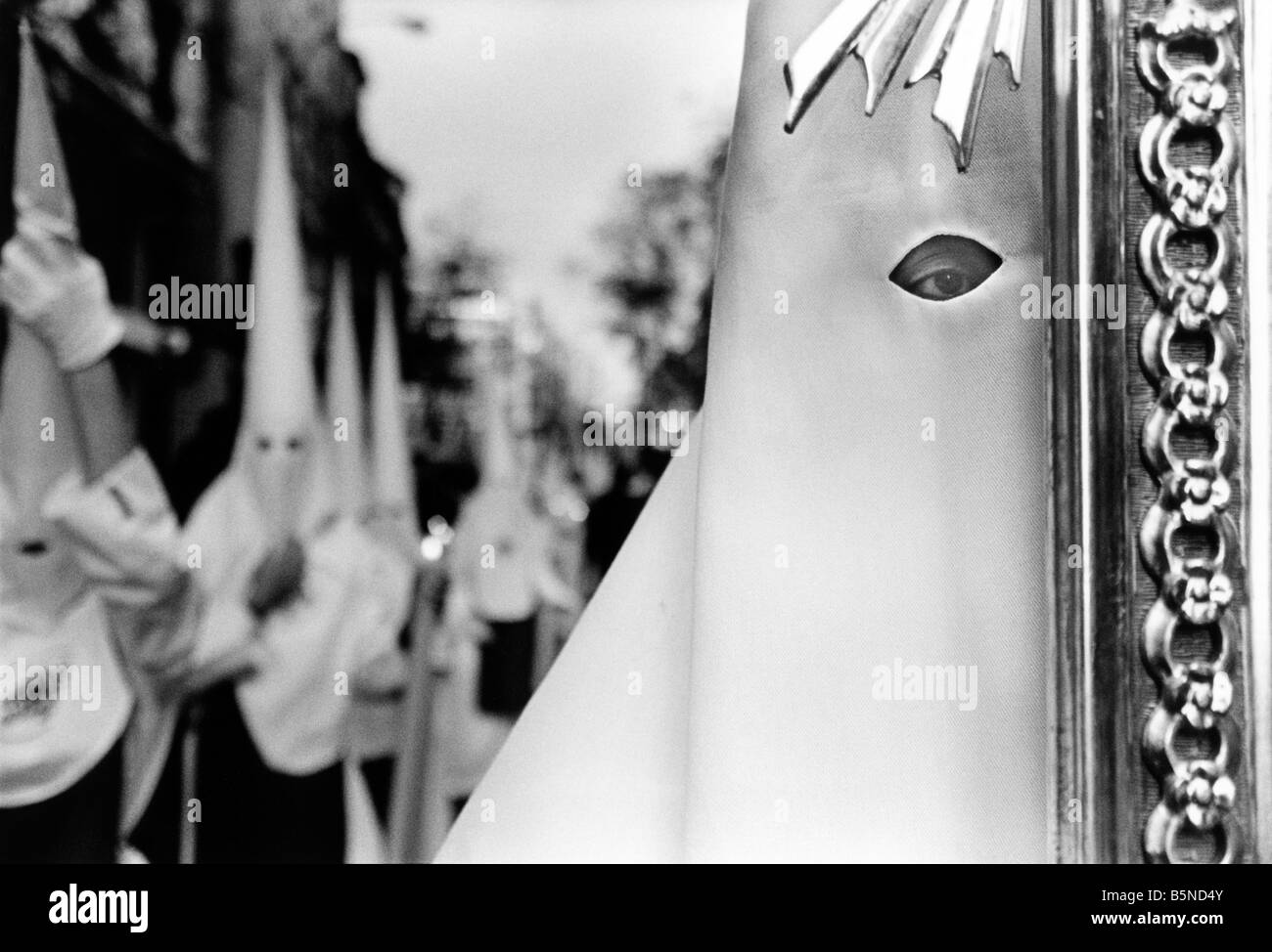 Hooded members of the Brotherhood during the Semana Santa processions ...