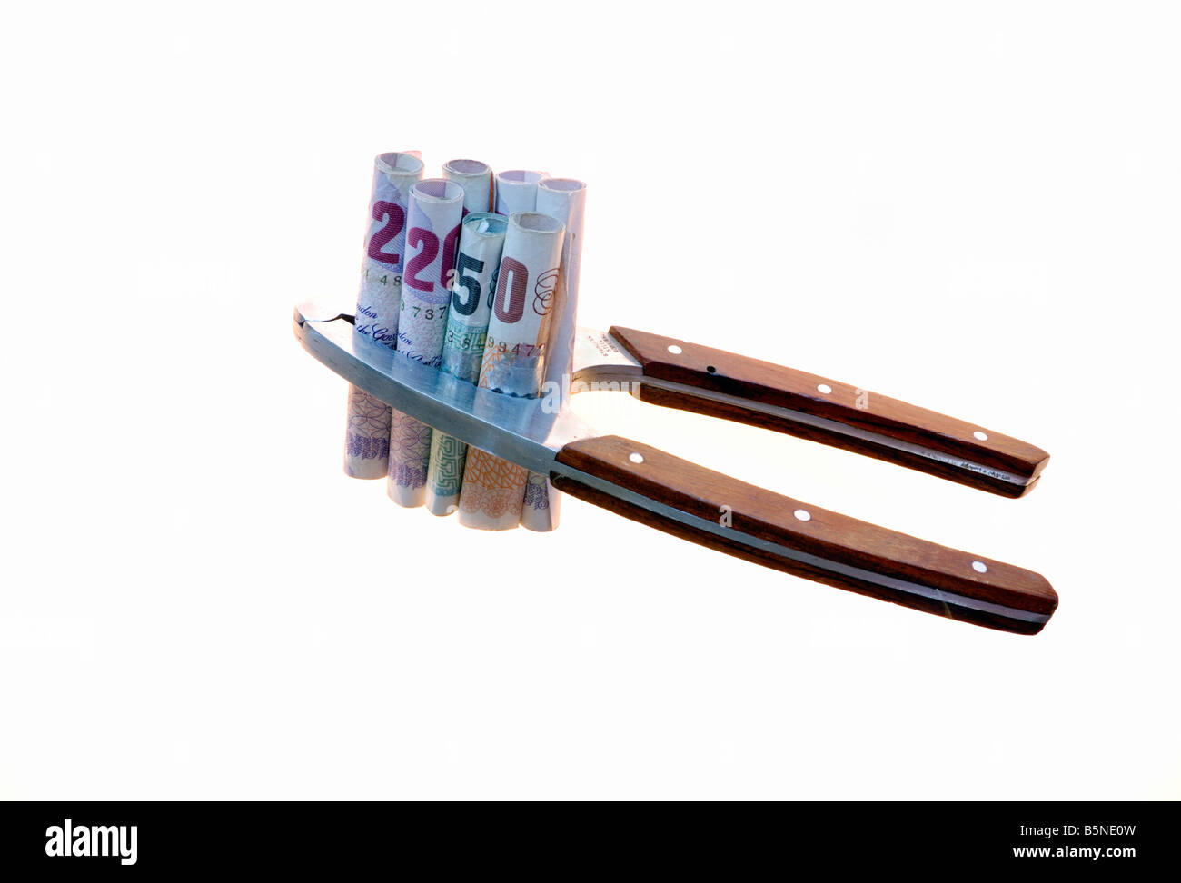 Money getting squeezed in credit Cut Out Stock Images & Pictures - Alamy