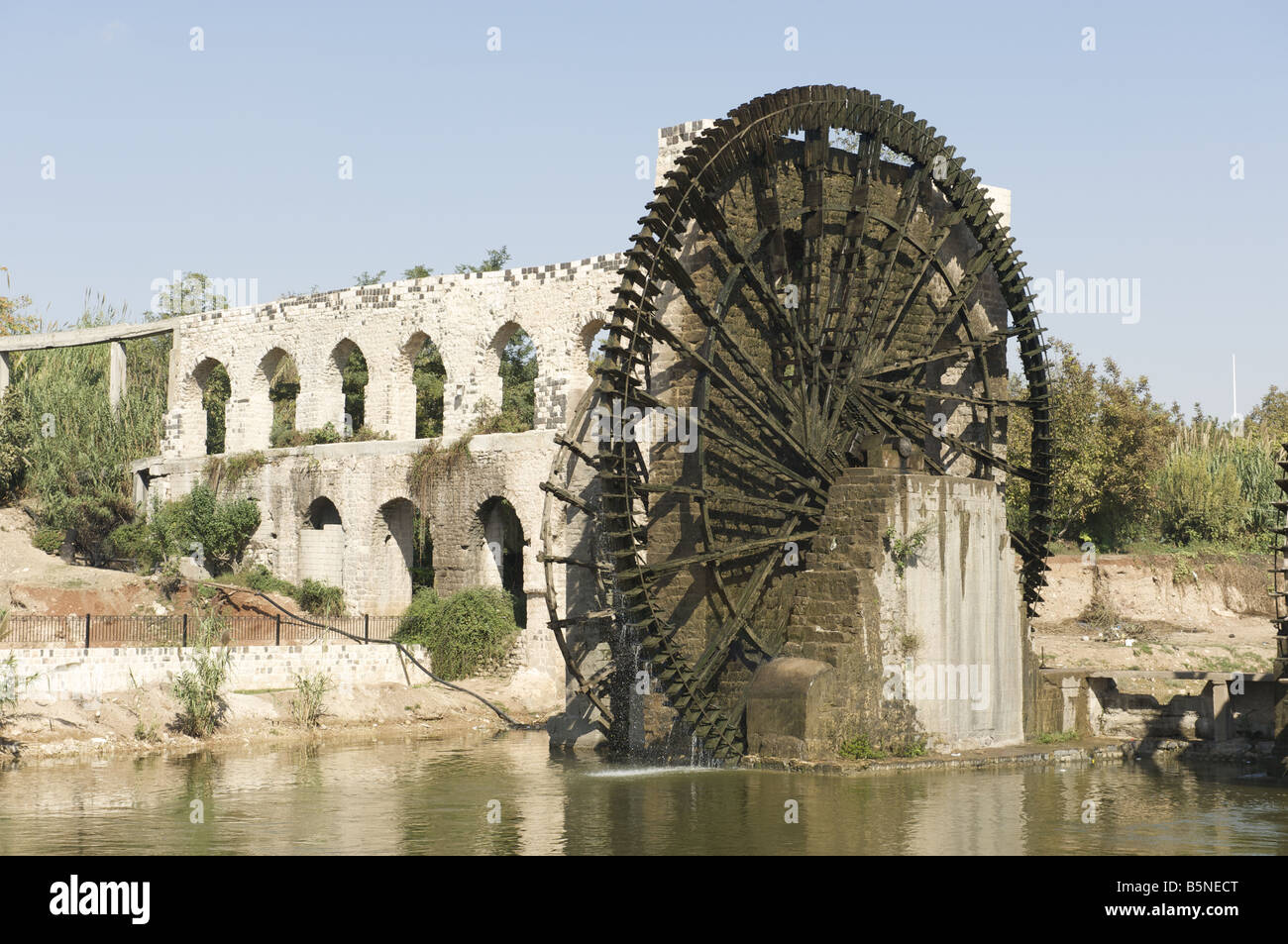 Noria with aqueduct, Hama, Syria Stock Photo - Alamy