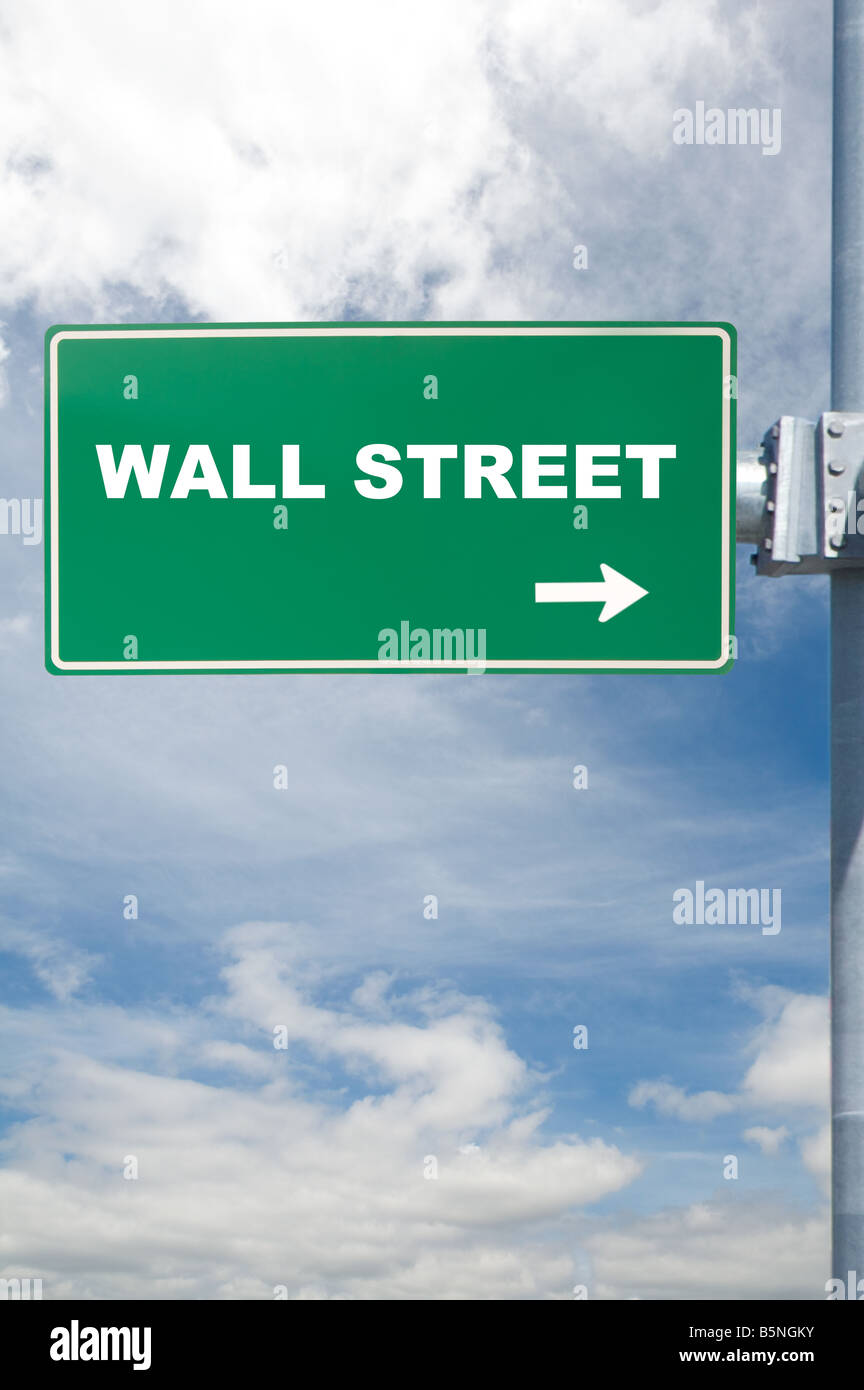 A large green traffic sign with wall street on it Stock Photo - Alamy