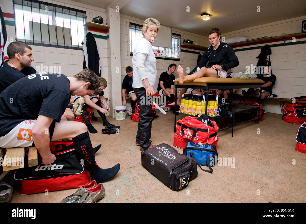Soccer team getting change in changing room before game Stock Photo - Alamy