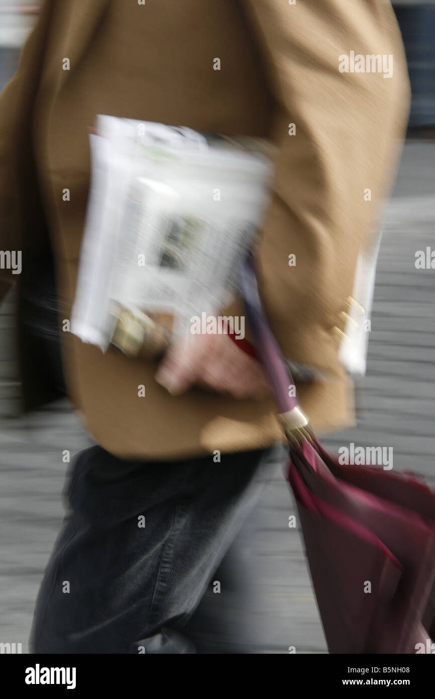 Fold carry carrying newspaper paper magazine old hide hi-res stock ...