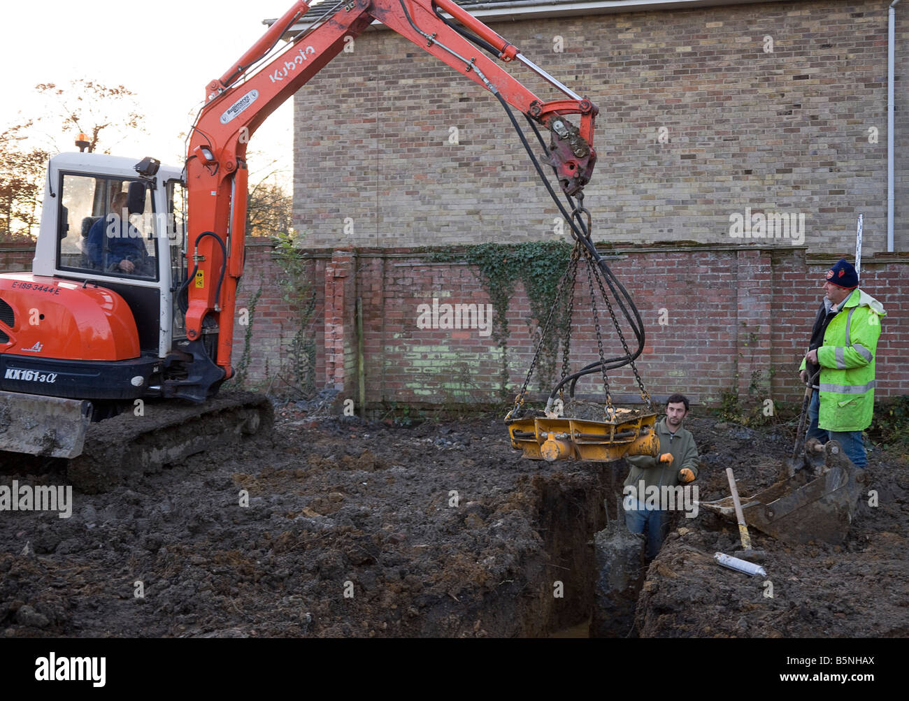Lifting the pile crusher, with the crushed concrete off of the pile ...
