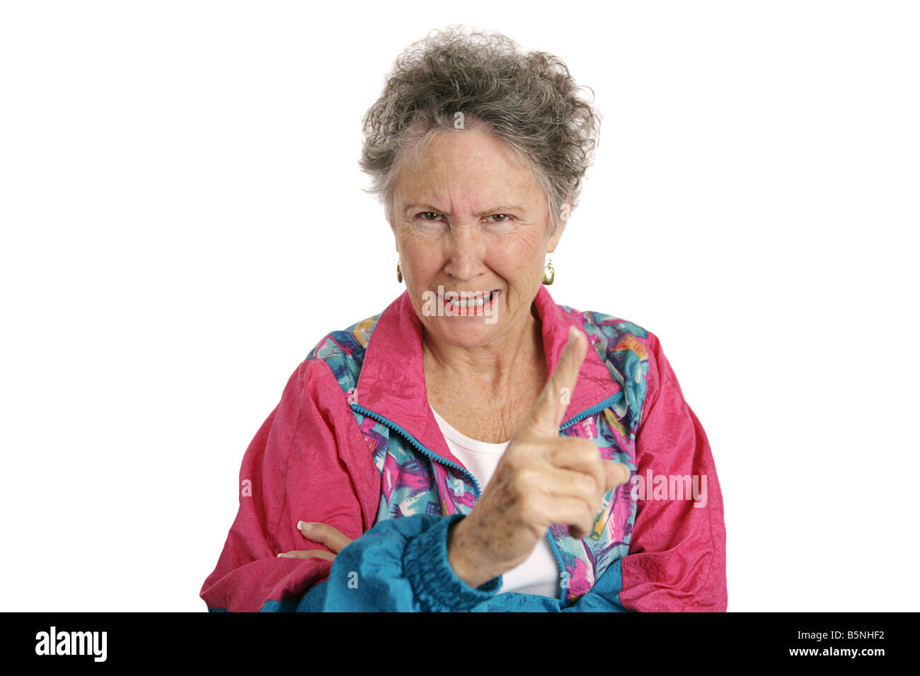 A retired senior woman in a track suit shaking her finger angrily ...