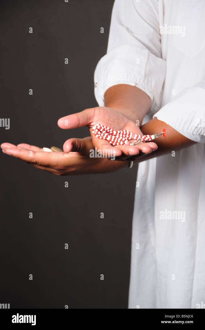 Detail of male human hands holding afrocuban religious charm Stock ...