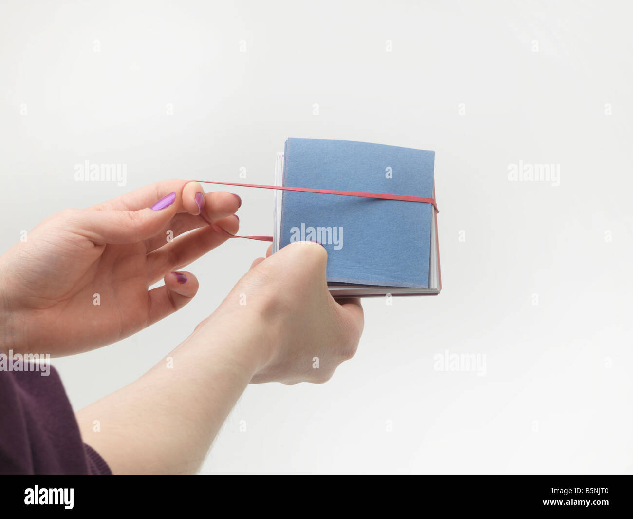 Stretching Elastic Band Round Paper Stock Photo - Alamy