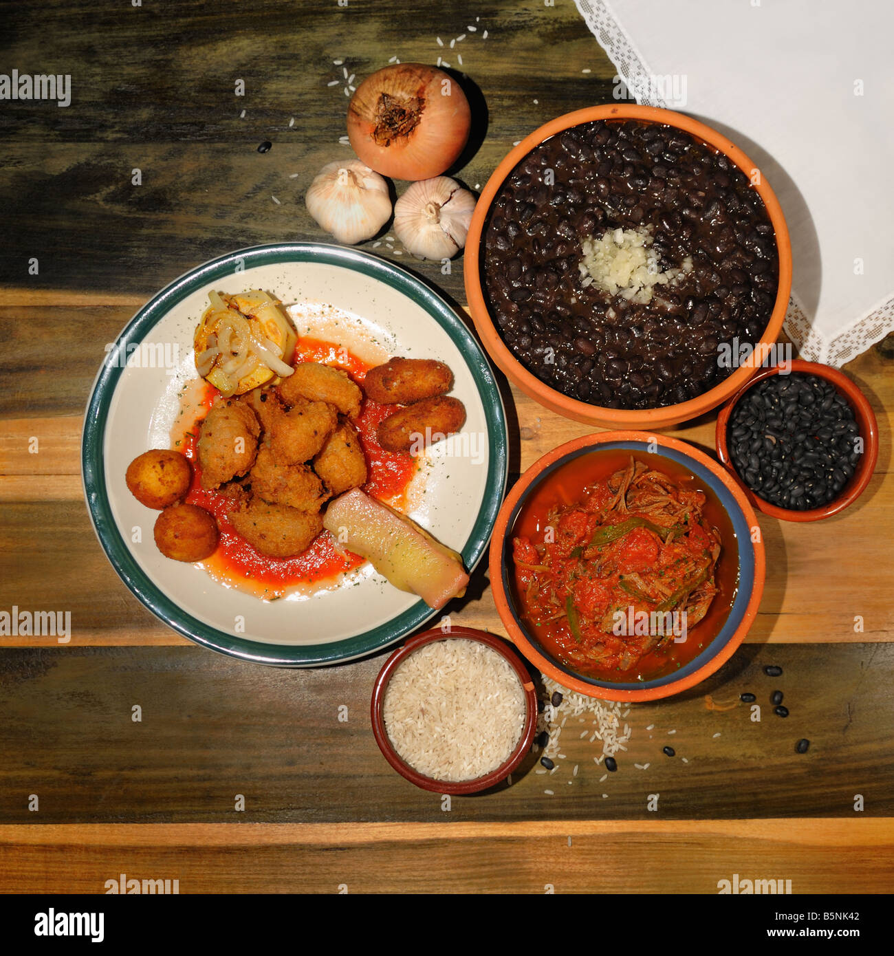Assorted typical cuban food dishes over wooded table Stock Photo - Alamy