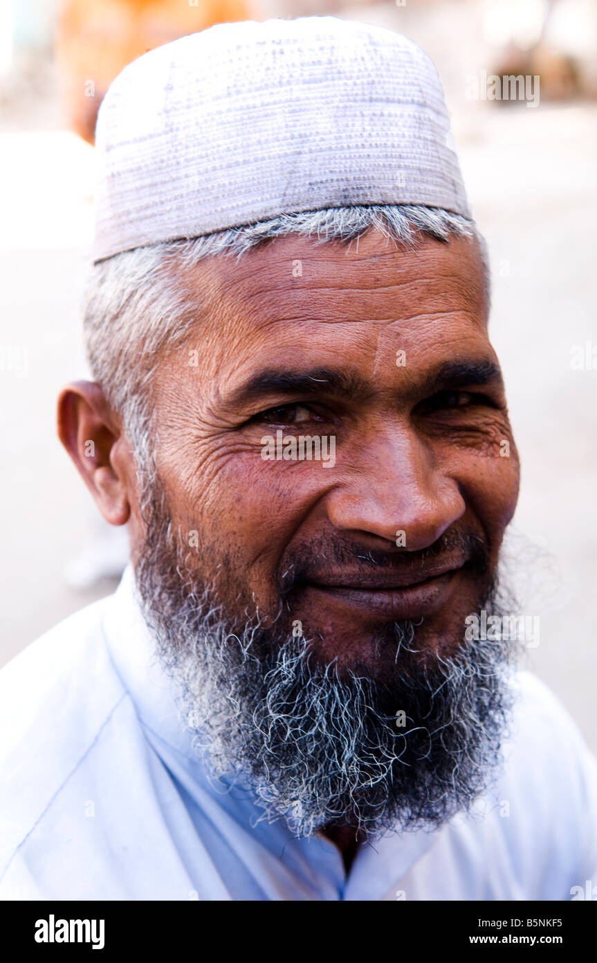 Portrait of a Muslim man wearing a traditional Muslim cap Stock Photo ...