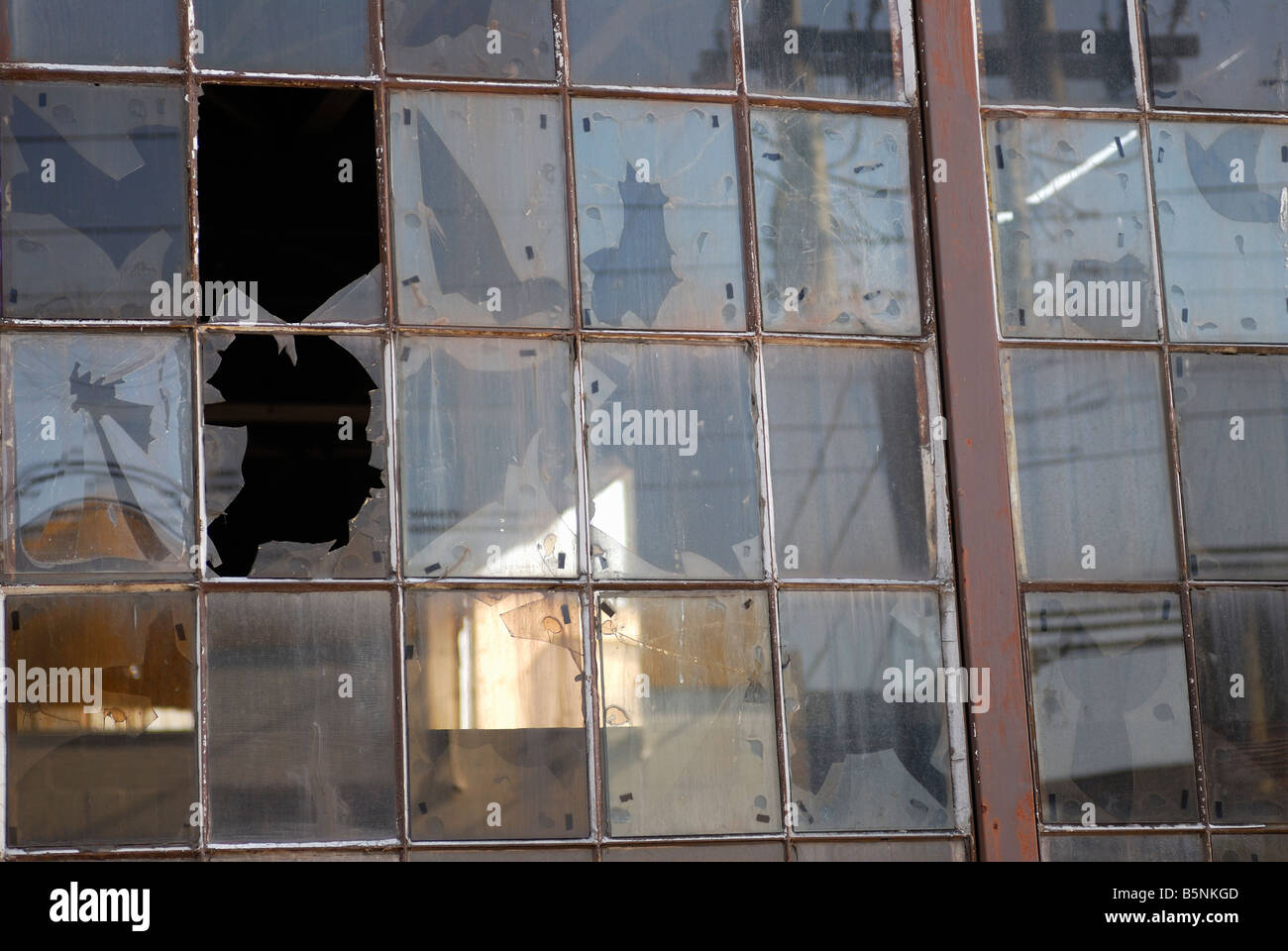 Broken glass windows of an abandon building down town British Columbia ...