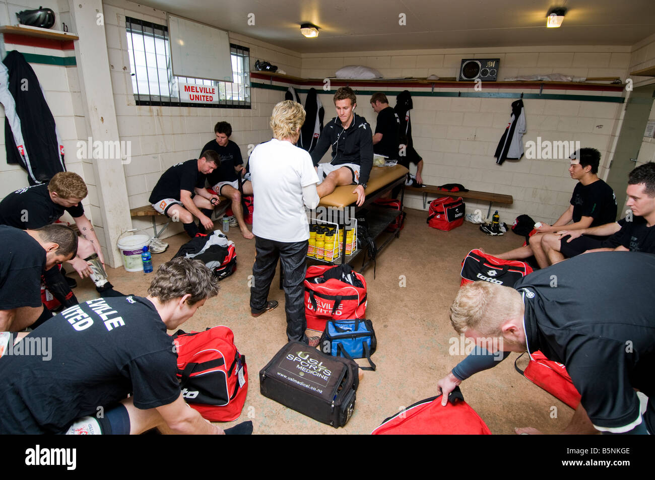 Soccer team getting change in changing room before game Stock Photo - Alamy