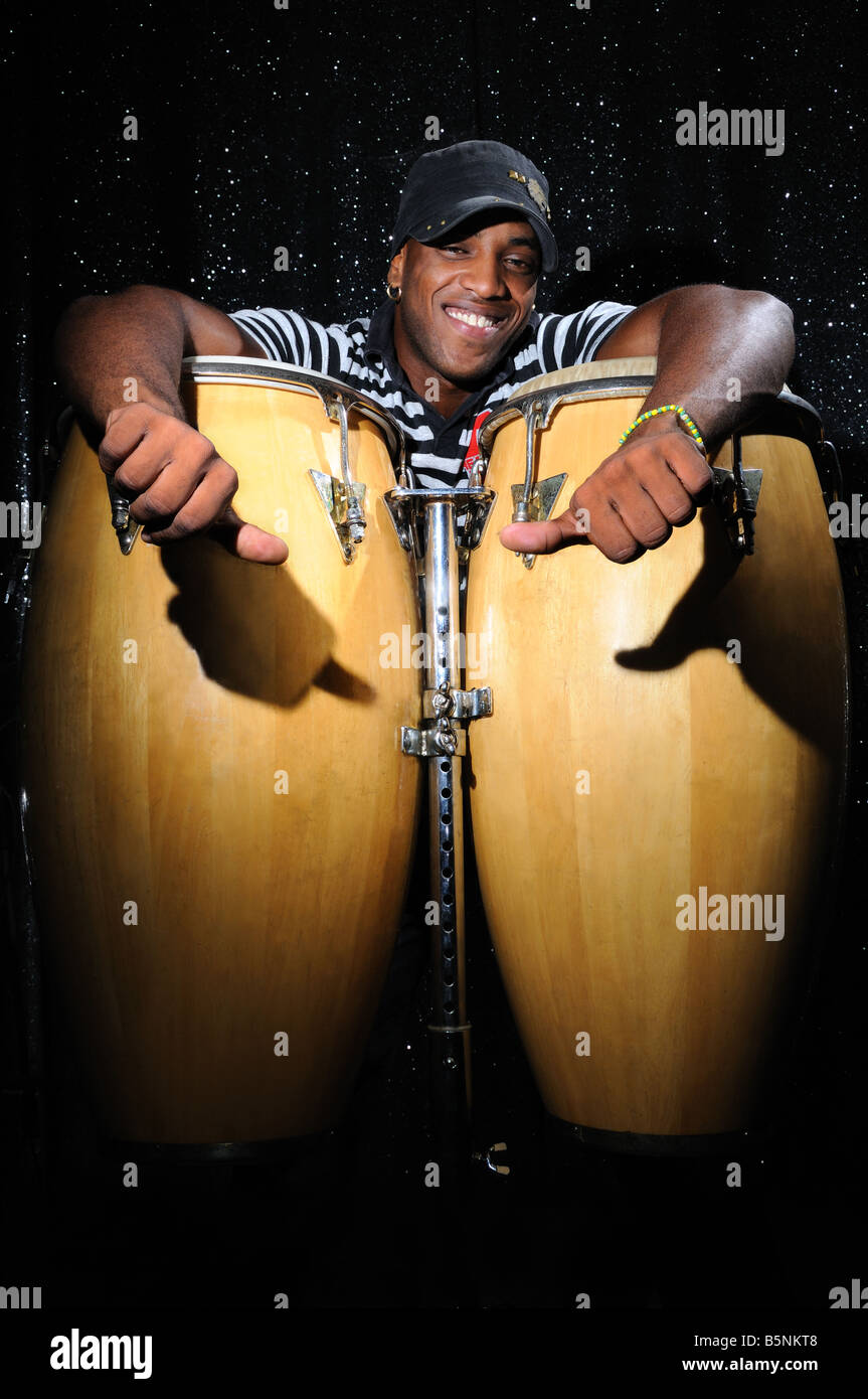 Portrait of young latino percussionist with african bongo drum Stock ...