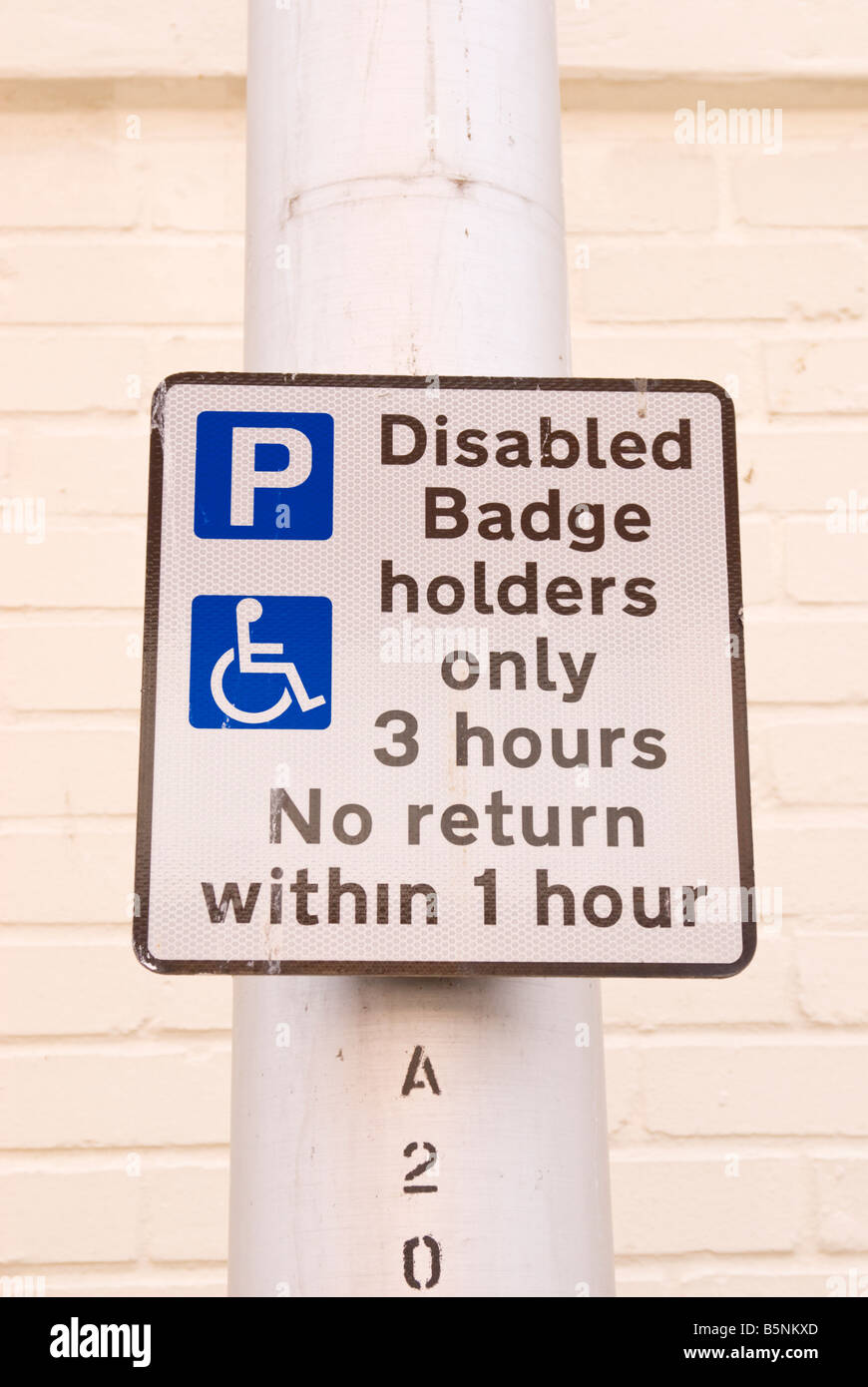 Road sign saying disabled badge holders only 3 hours no return within 1 ...