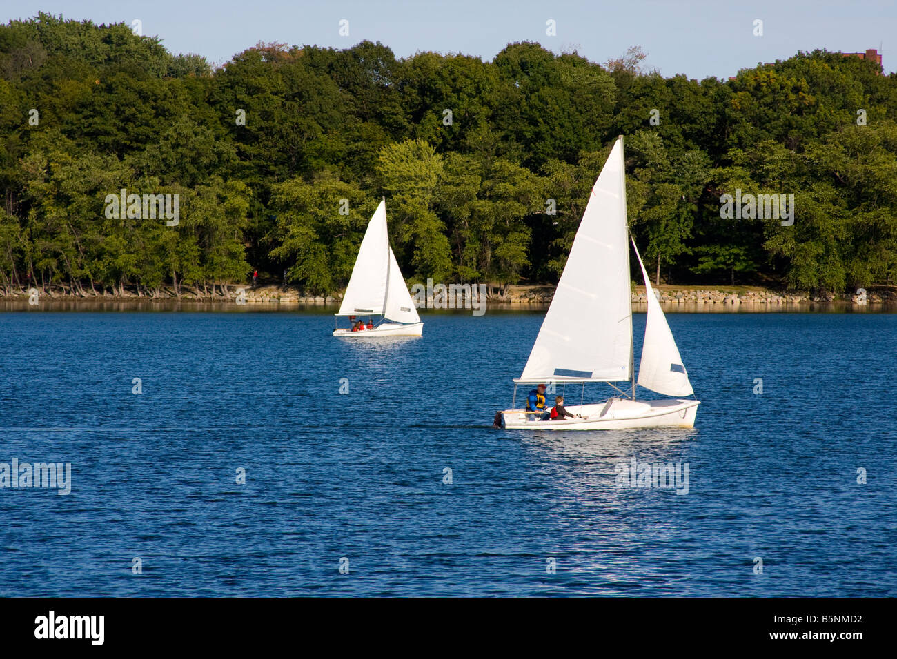 Two sailboats on a lake Stock Photo - Alamy