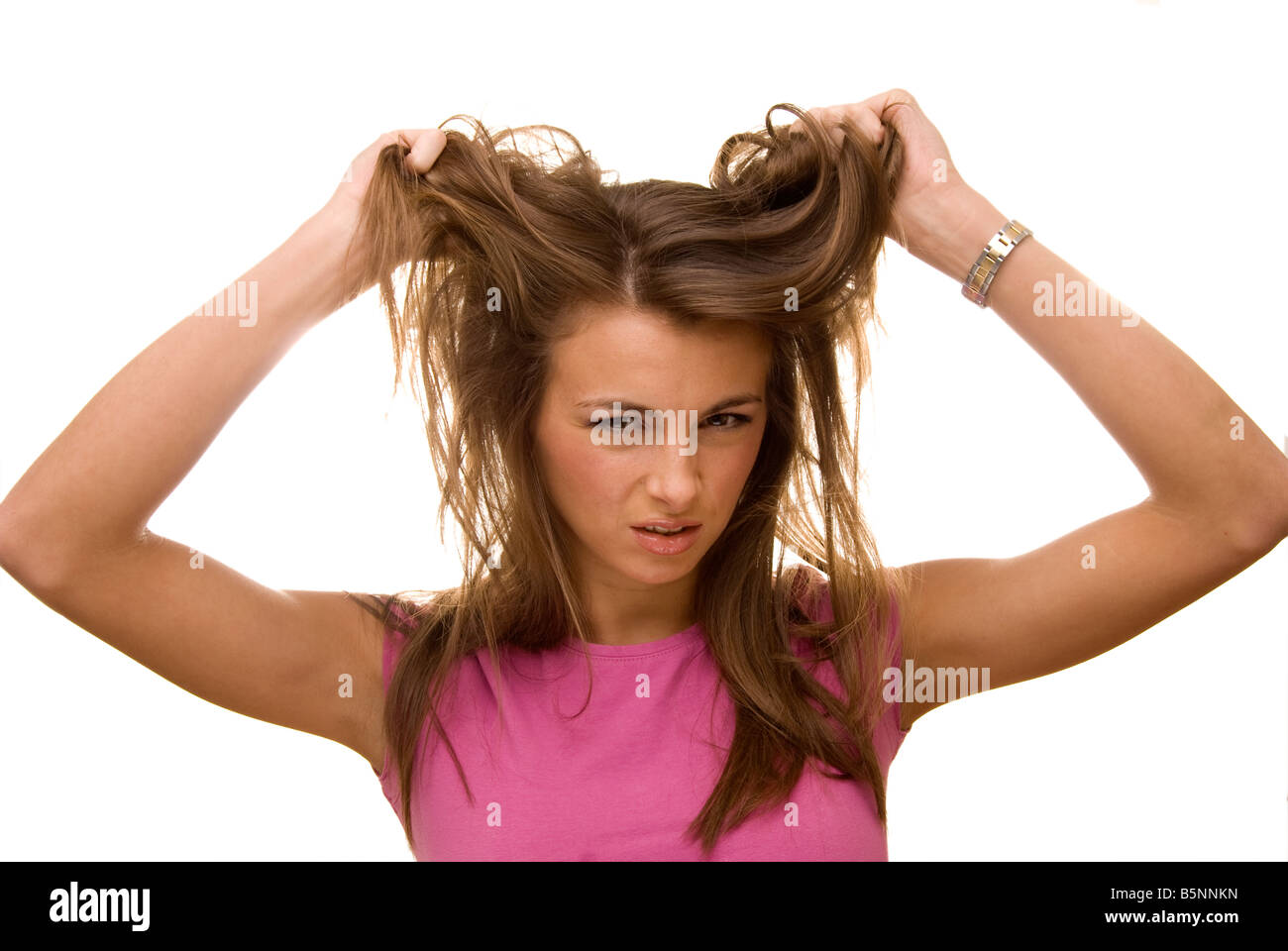 young woman pulling her hair Stock Photo - Alamy