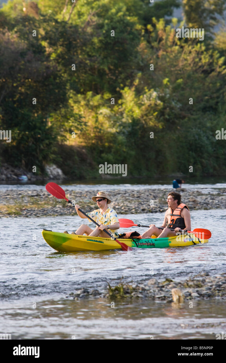 Tourists kayaking down the Nam Song river at Vang Vieng Laos Stock ...