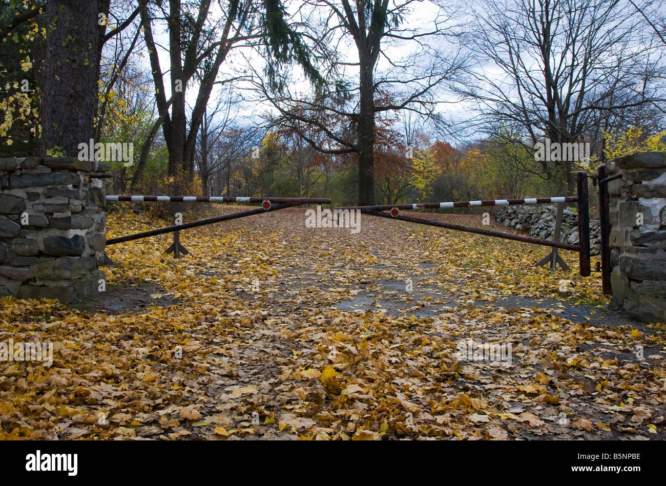 Gates blocking access to a road Stock Photo - Alamy