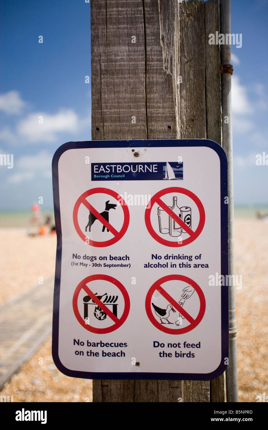 Beach regulation notice on pole at Eastbourne Stock Photo - Alamy