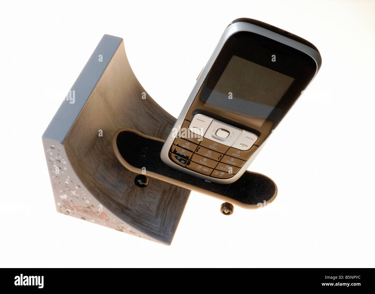 Mobile phone on skateboard Stock Photo - Alamy