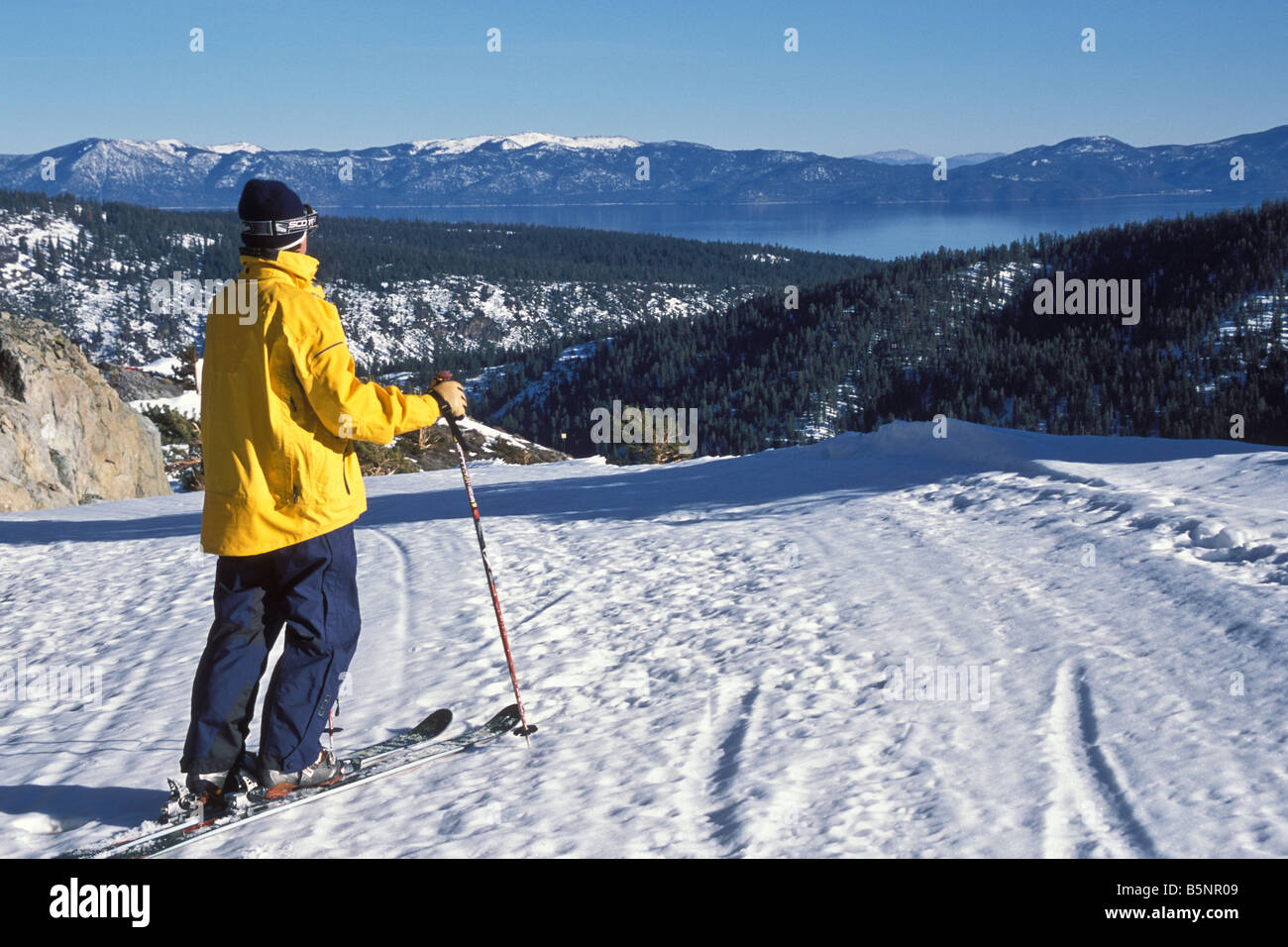 Skier admires a view of Lake Tahoe from atop the KT 22 lift, Squaw ...