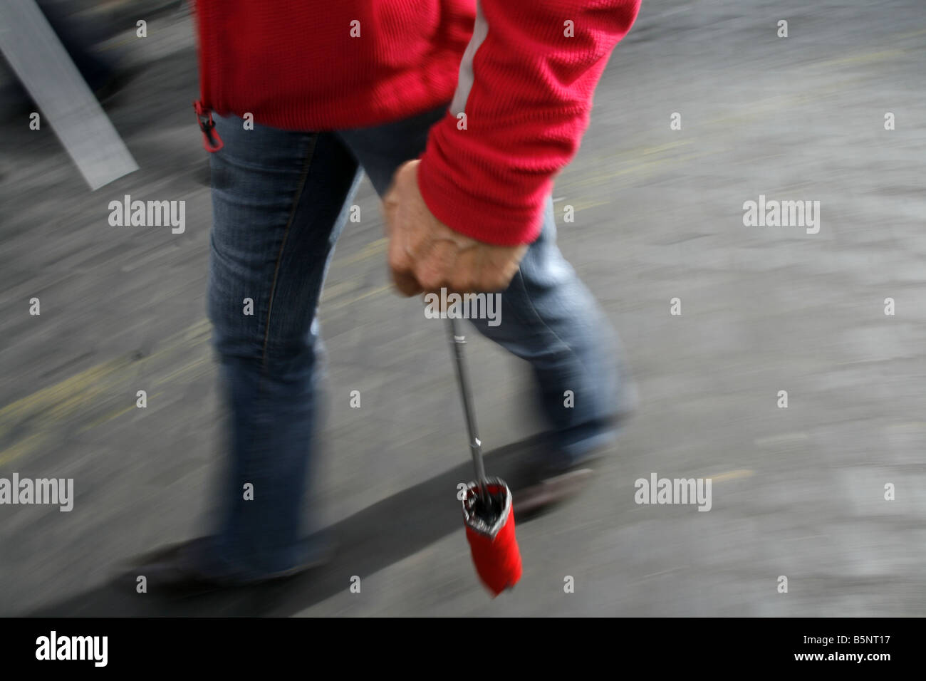 one person walking in street in city town Stock Photo - Alamy