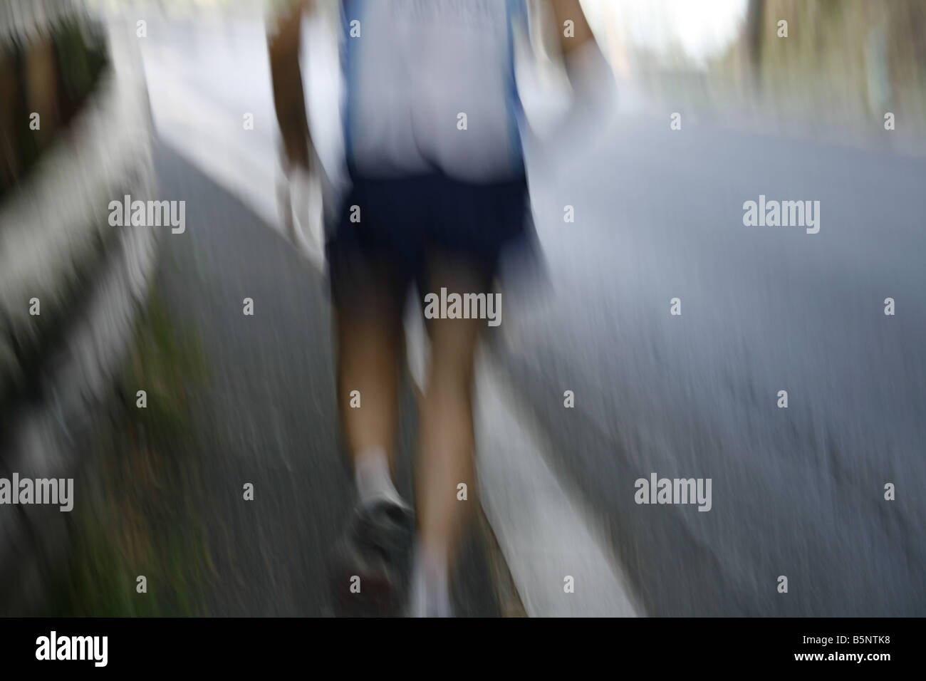 one fast runner in action on street in countryside Stock Photo - Alamy