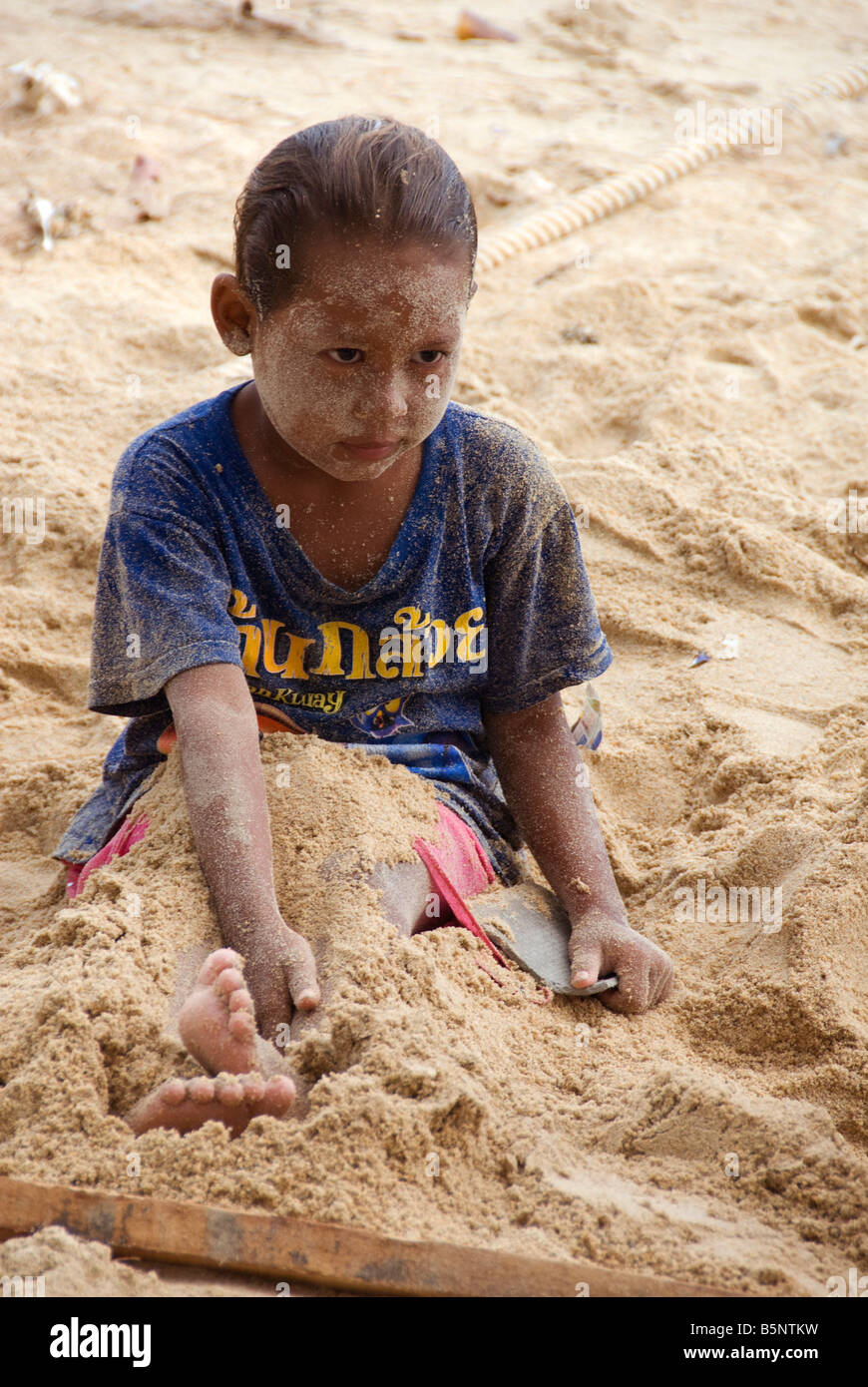 Urak Lawoi girl enjoyed playing with sand at Rawai Village, Phuket ...