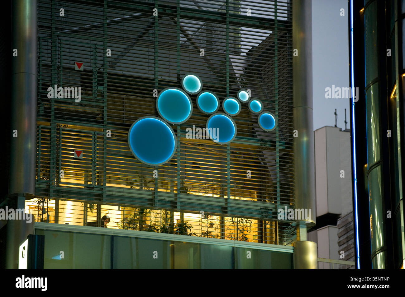 Neon lights on a skyscraper in the Nishi Shinjuku business district in ...