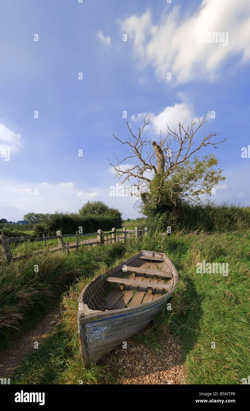 a wooden boat in the countryside Stock Photo - Alamy