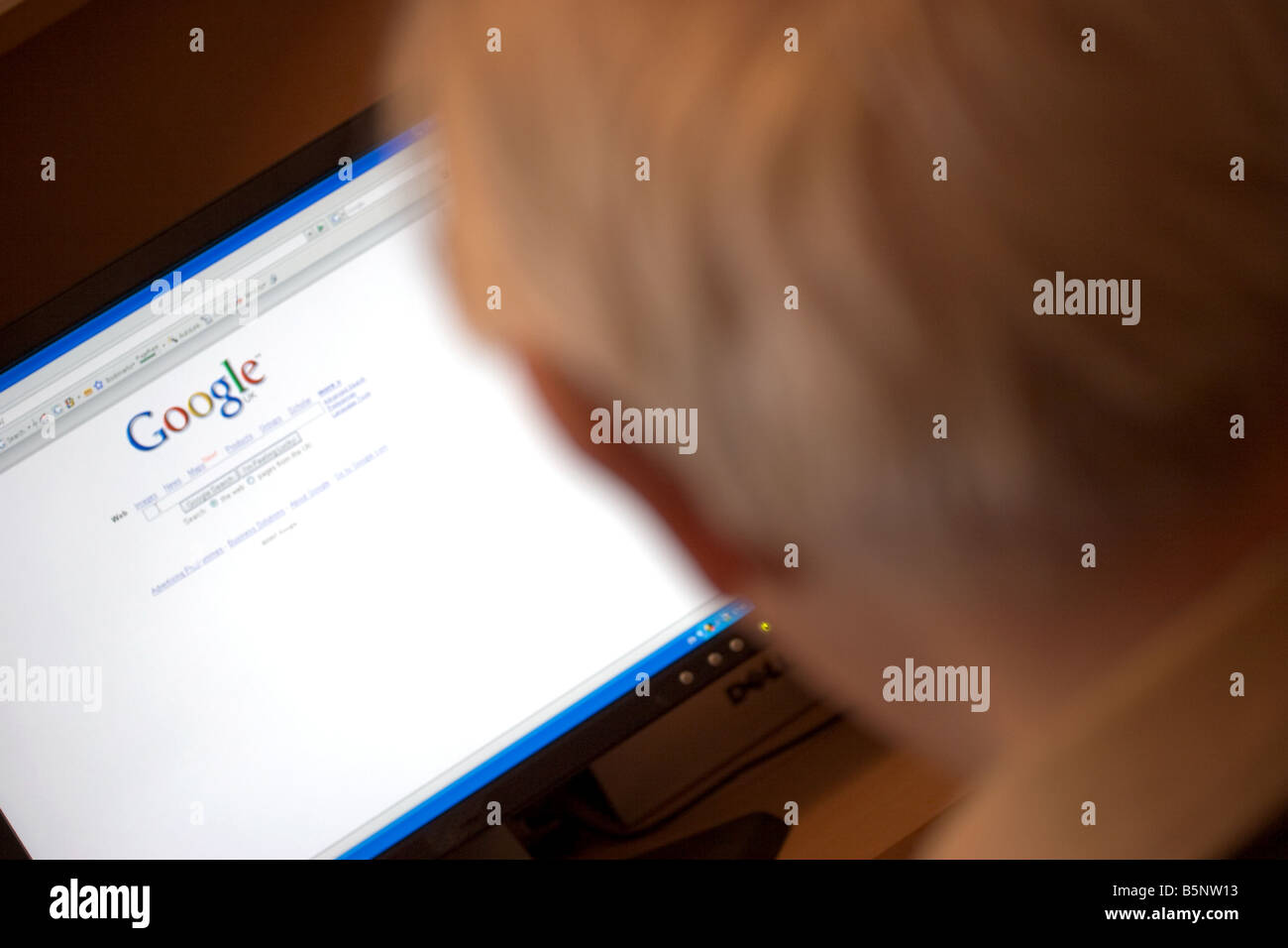 Elderly man using the internet Stock Photo - Alamy