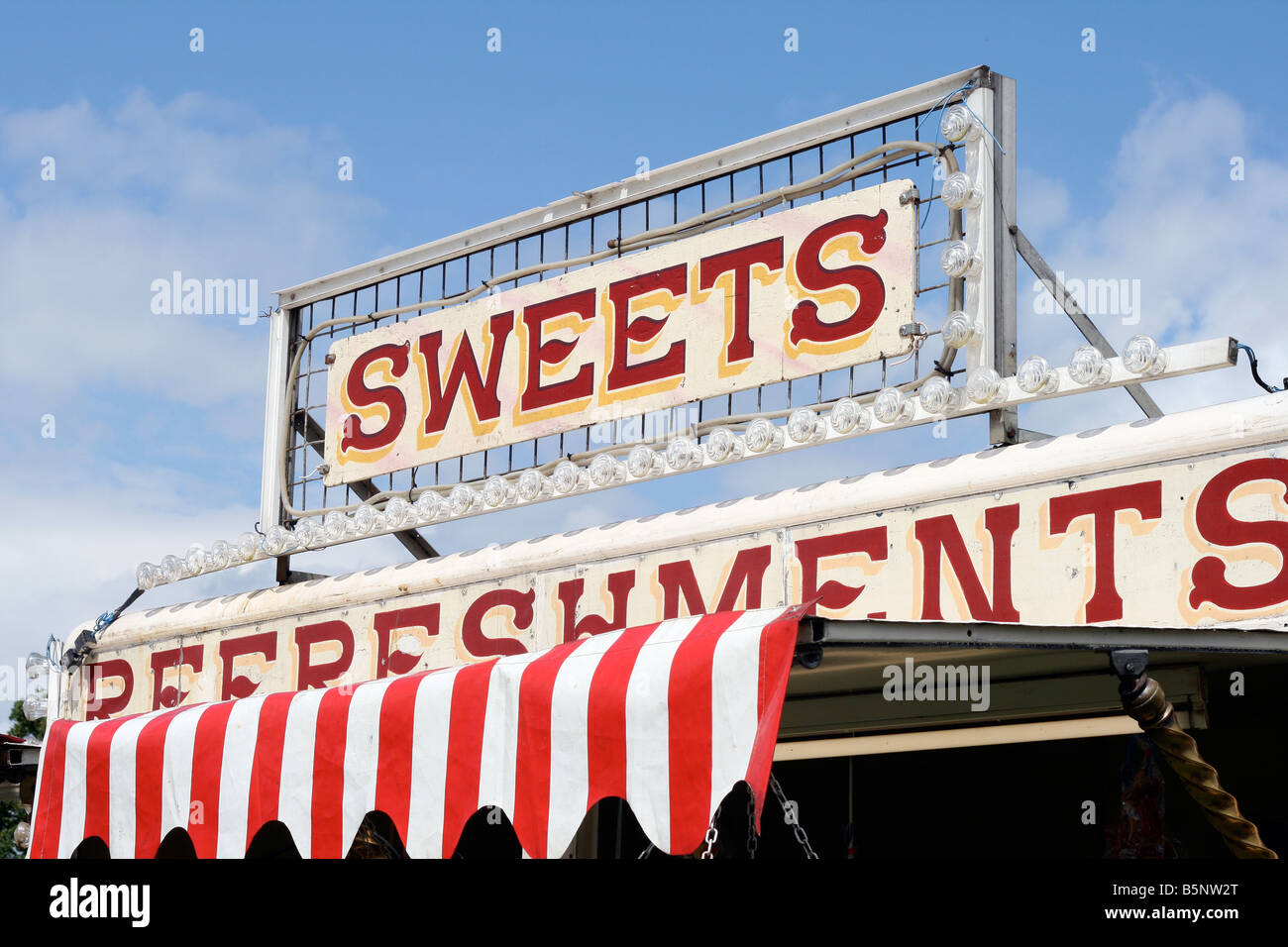 Sweets sign on a stall at a fair Stock Photo - Alamy