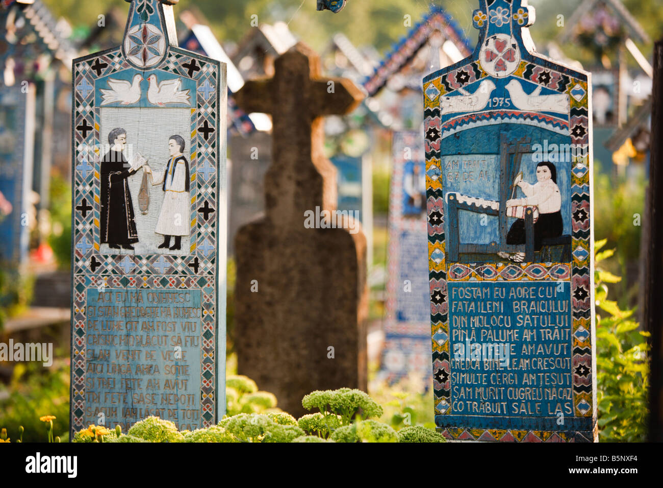 colorful painted wooden headstones in sapanta merry cemetery, maramures ...