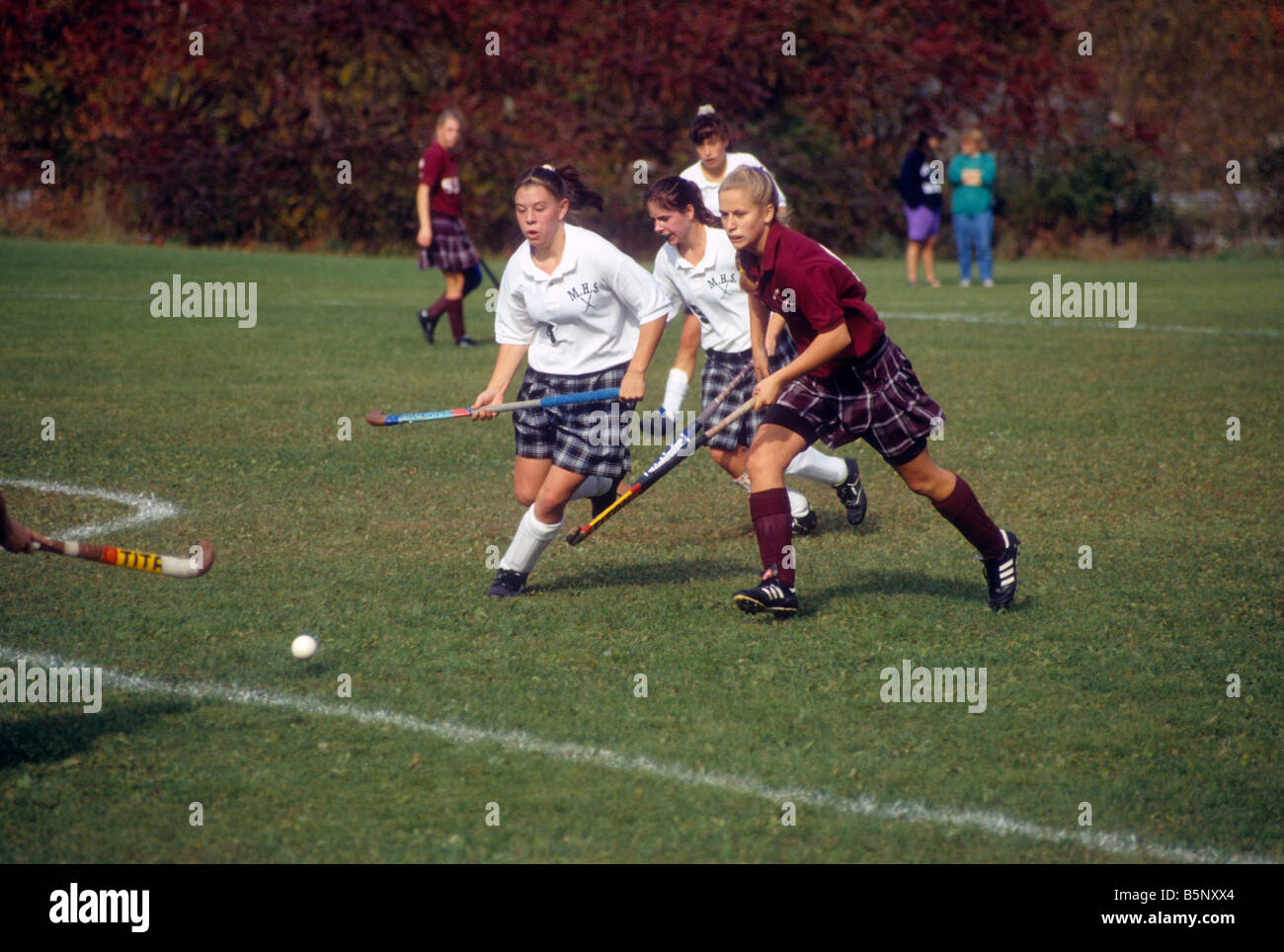 High school girls play field hockey Stock Photo - Alamy