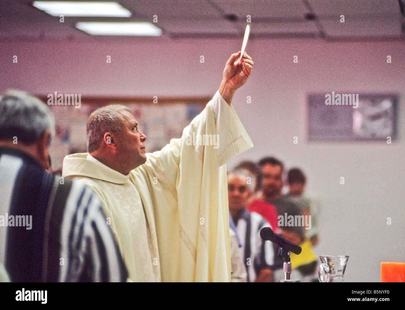 Priest holds host hi-res stock photography and images - Alamy
