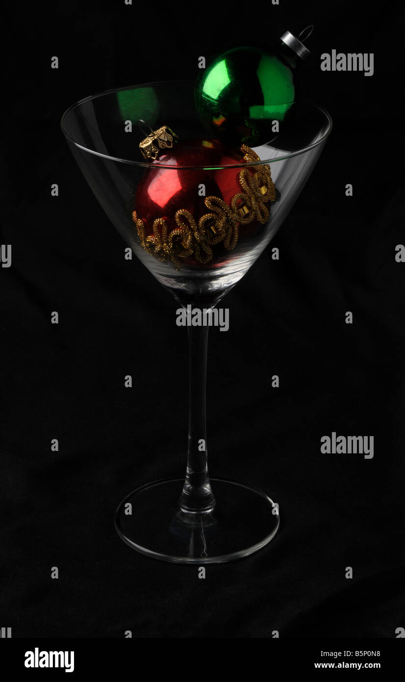 cocktail glass and two christmas baubles Stock Photo - Alamy