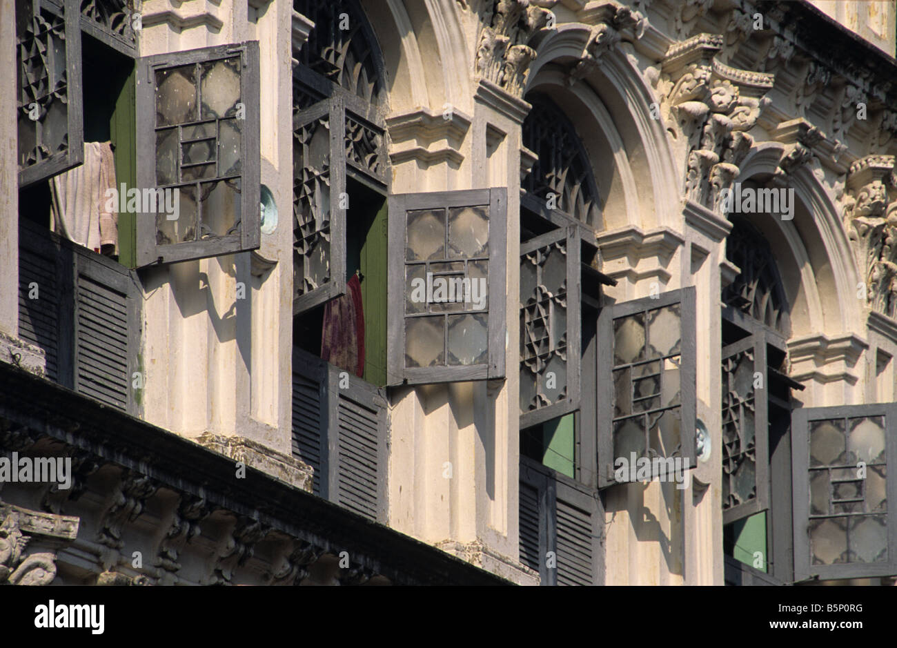 Colonial-era shutters and windows, central Rangoon or Yangon, Burma or ...